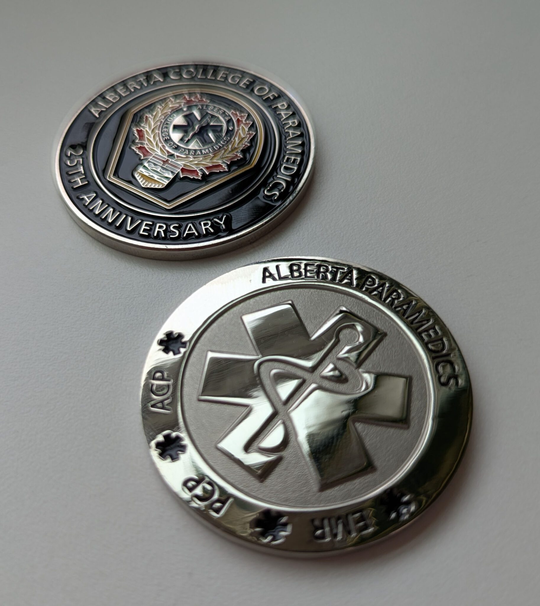 25th Anniversary Challenge Coins Now Available – Alberta College of ...